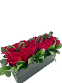 A Pave of Red Roses With Grass Hearts and Foliages